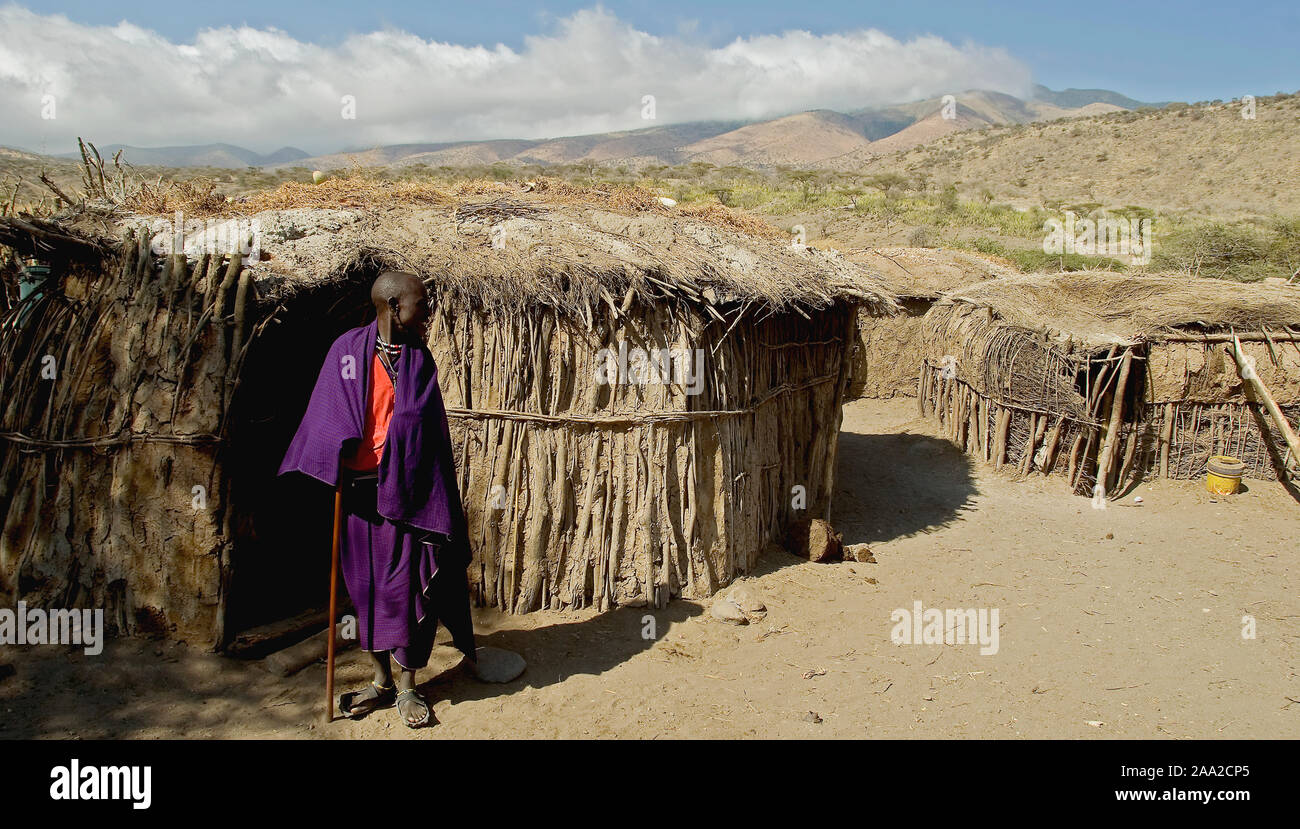 Maasai man outside his hut Stock Photo - Alamy