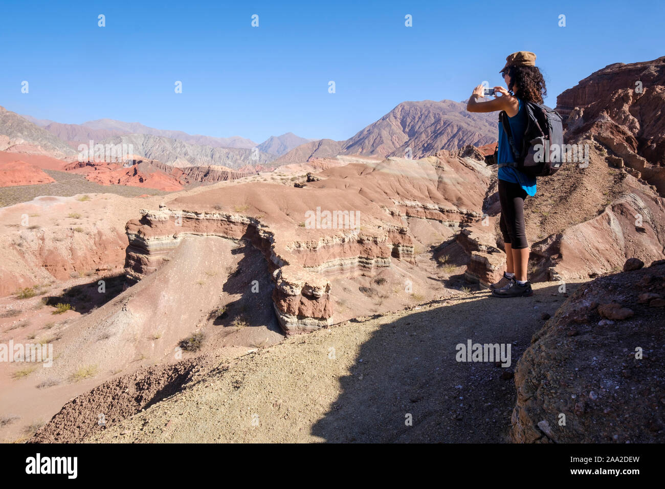 Female tourist photographing a panoramic view of the colorful ...