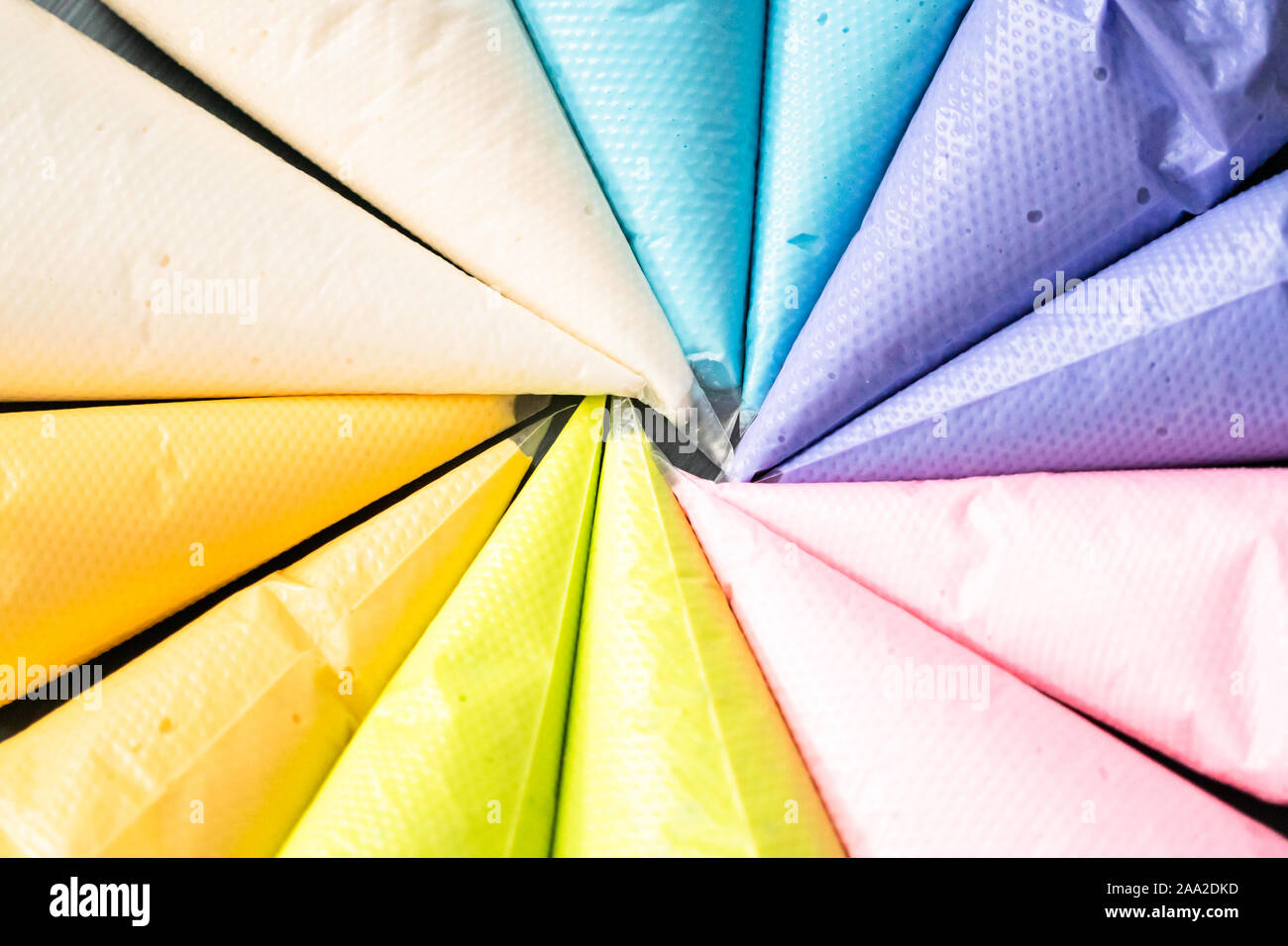 Variety of colors of royal icing in plastic piping bags Stock Photo - Alamy