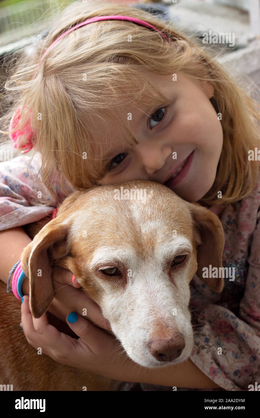 Little girl and her dog; children and pets Stock Photo - Alamy
