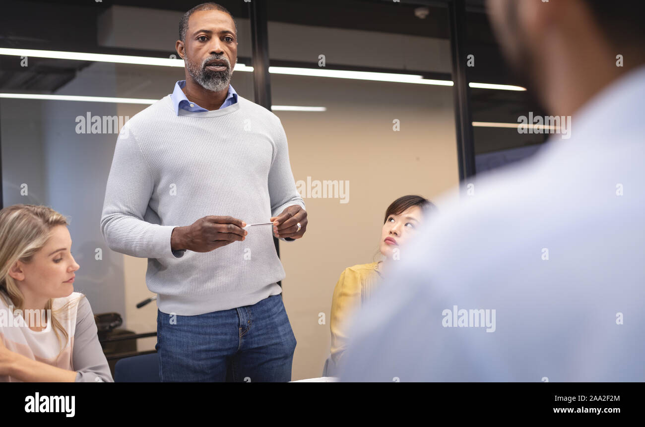 Mature male professionals discussing hi-res stock photography and ...