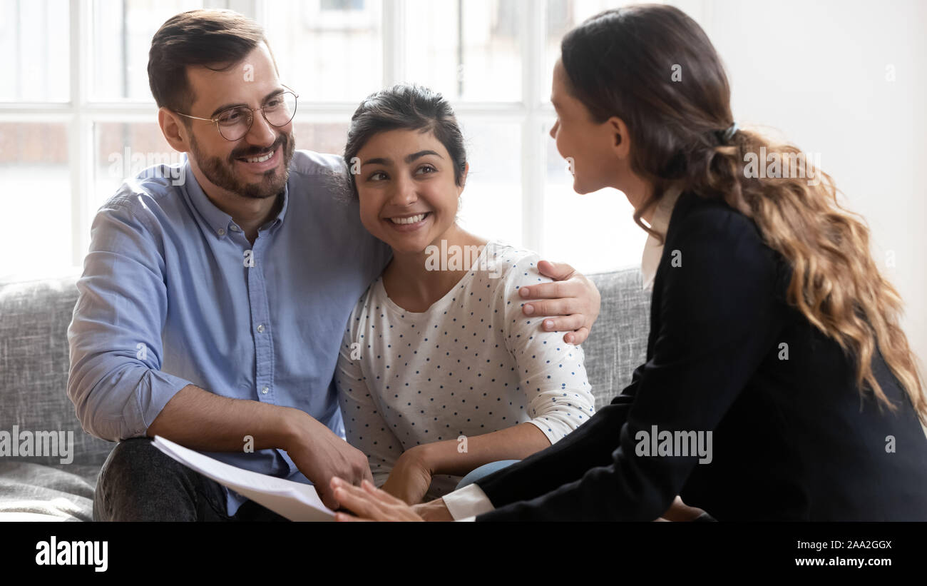 Happy family couple clients meeting professional real estate agent ...