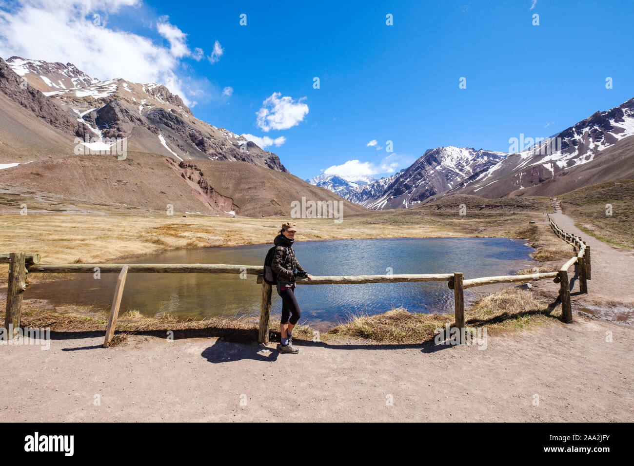 Female visitor on the Lagoon Los Horcones in the Aconcagua Park with ...