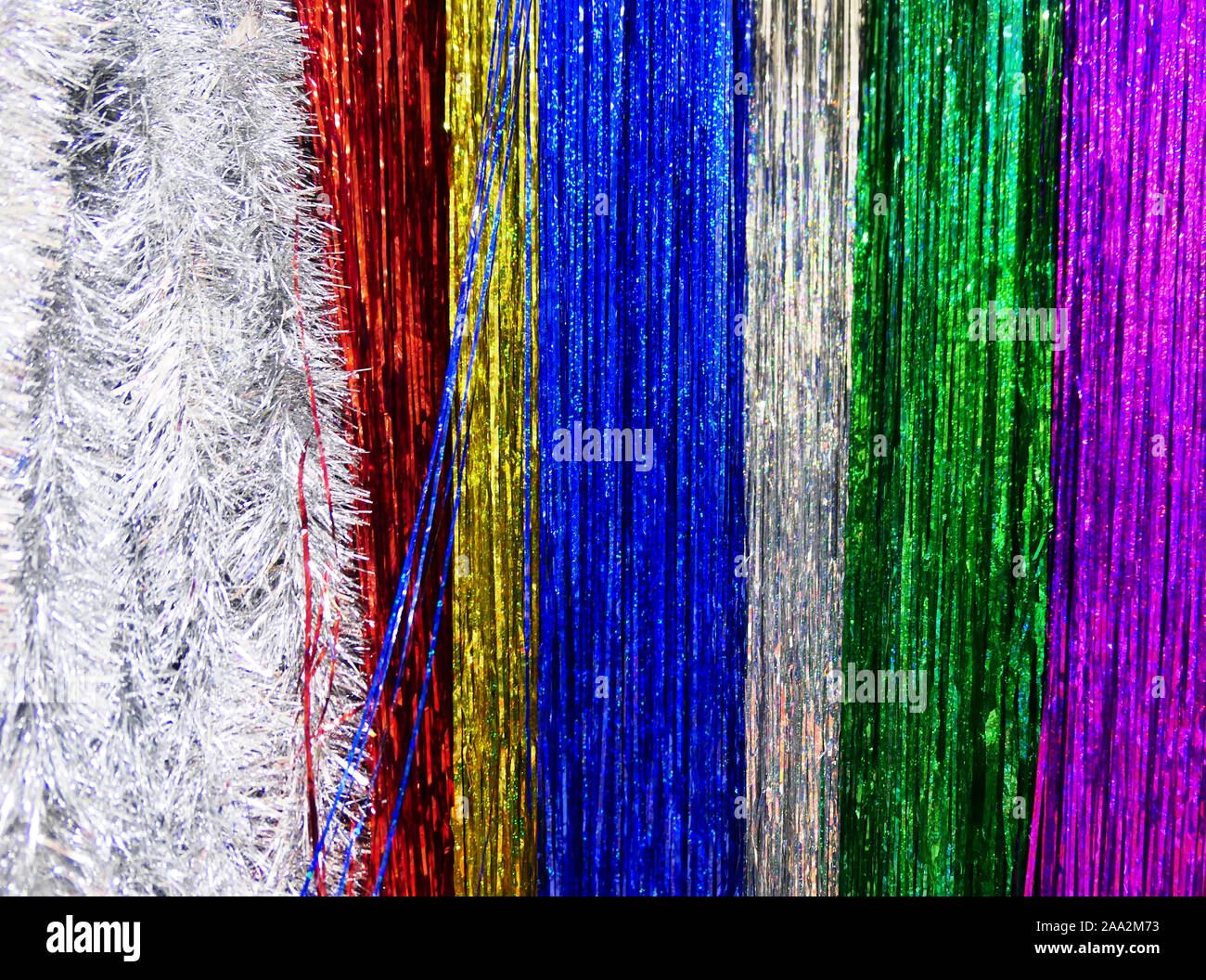 Tinsel garland background Stock Photo - Alamy