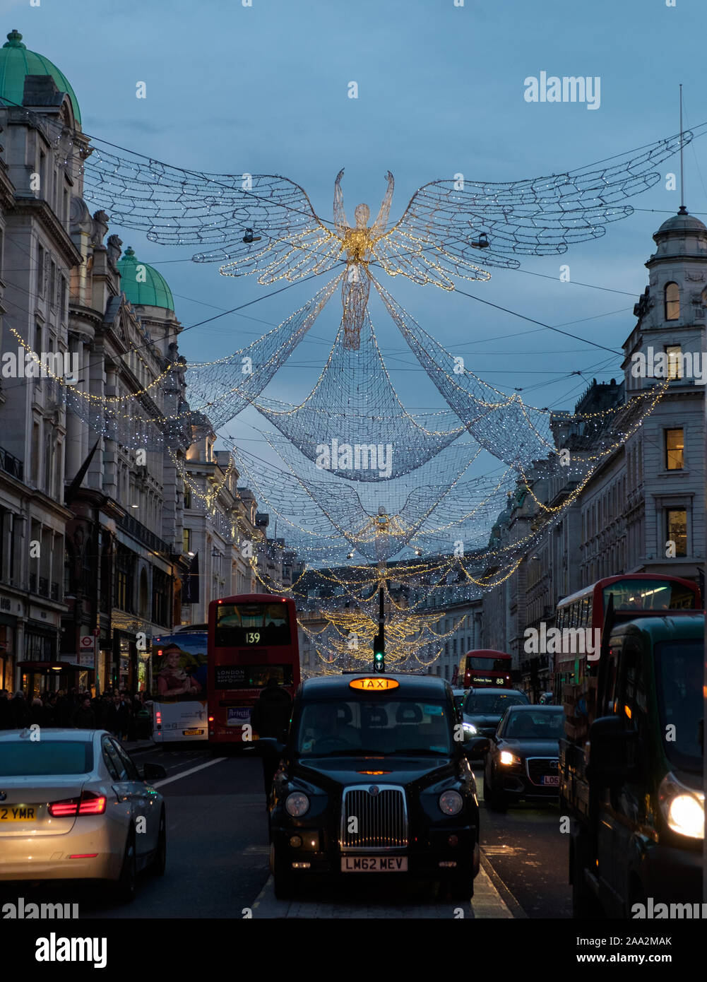 Christmas Angel lights with uplifted arms across Regent Street Central ...