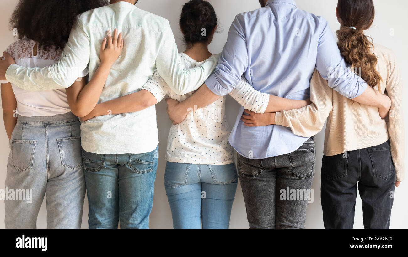 Multiracial young company staff cuddling. teamwork concept Stock Photo ...