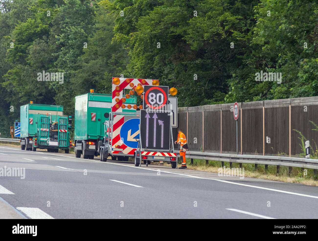 highway scenery including a mobile traffic sign in Germany at summer ...