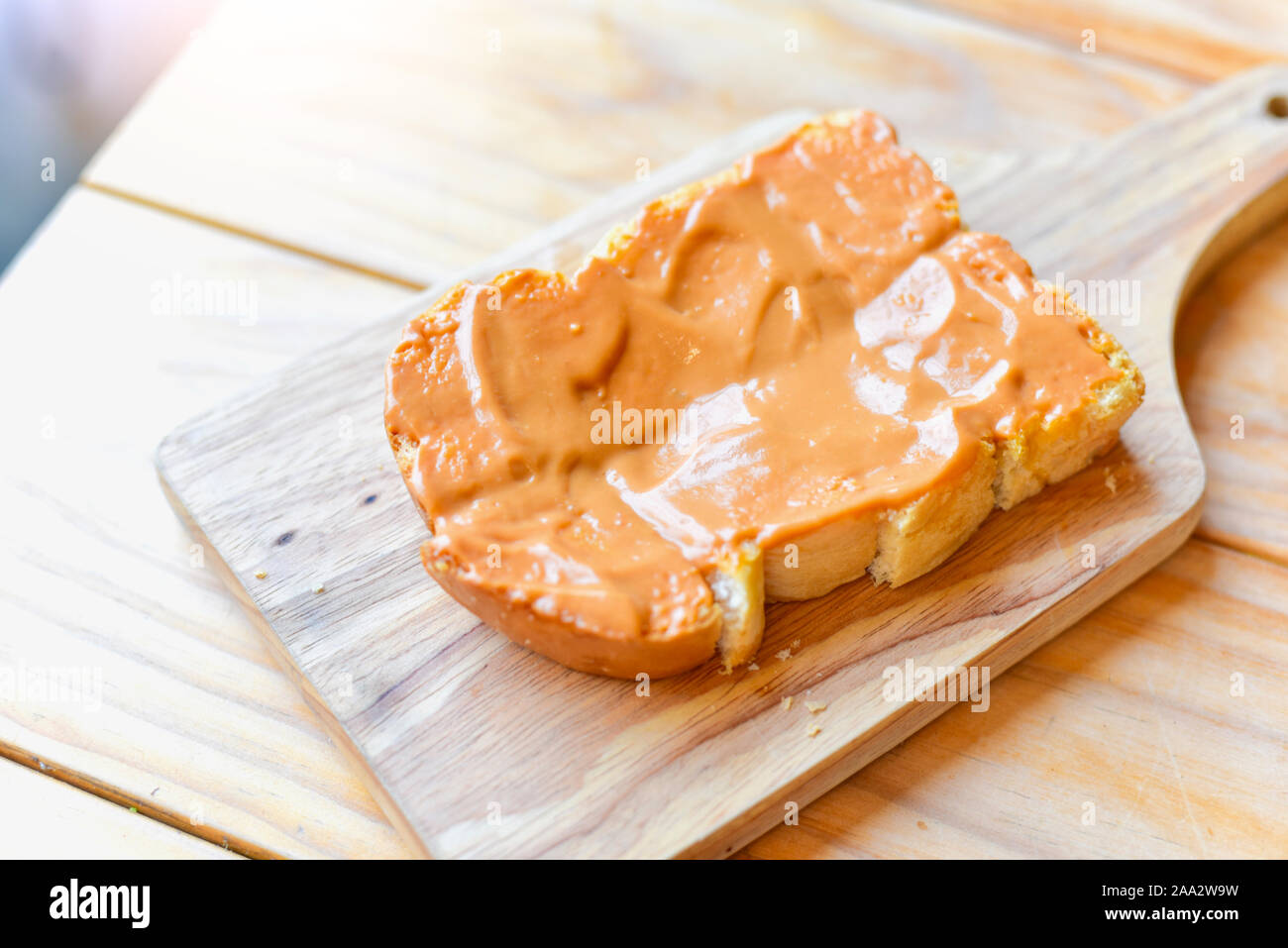Thai Tea Custard Toast on Wooden Board Stock Photo - Alamy