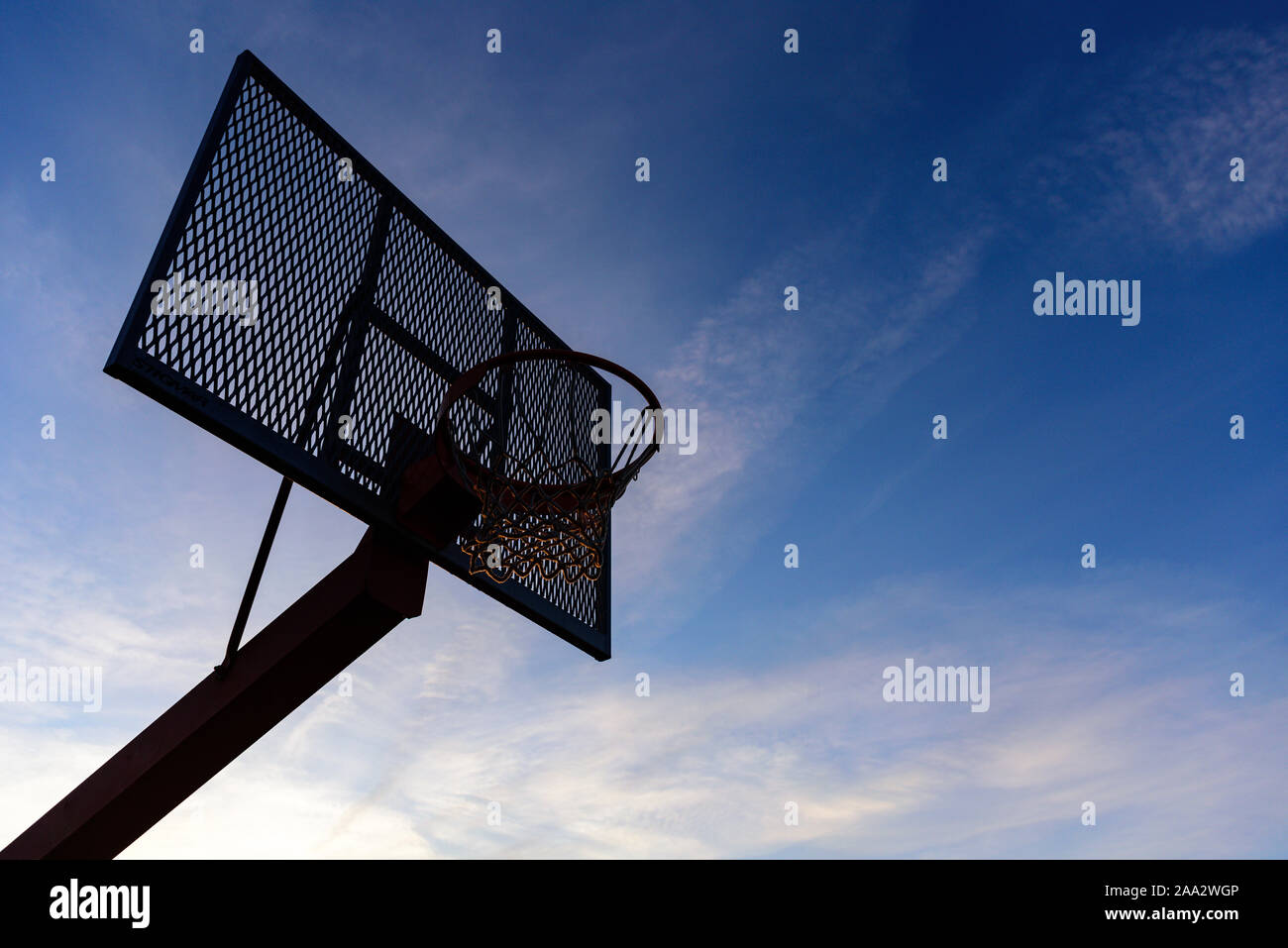 Street basketball hoop on sunset sky. Goal and win concept Stock Photo ...