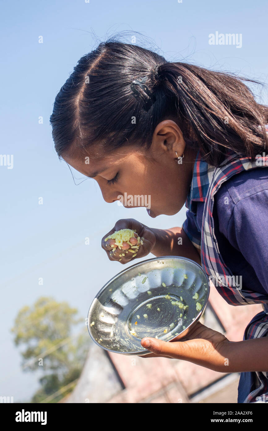 Indian child eating hi-res stock photography and images - Alamy