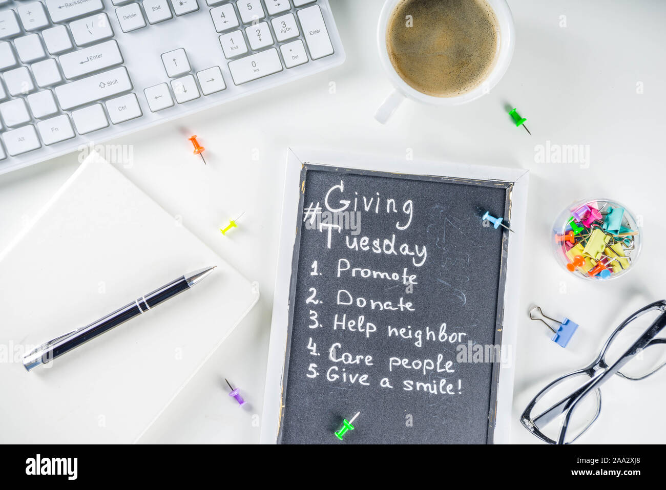 Chalk board with list of tasks, ideas, task for Giving Tuesday. Notes ...