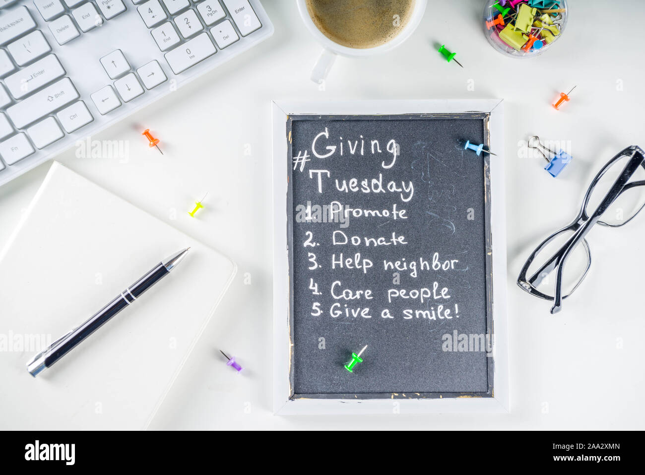 Chalk board with list of tasks, ideas, task for Giving Tuesday. Notes ...