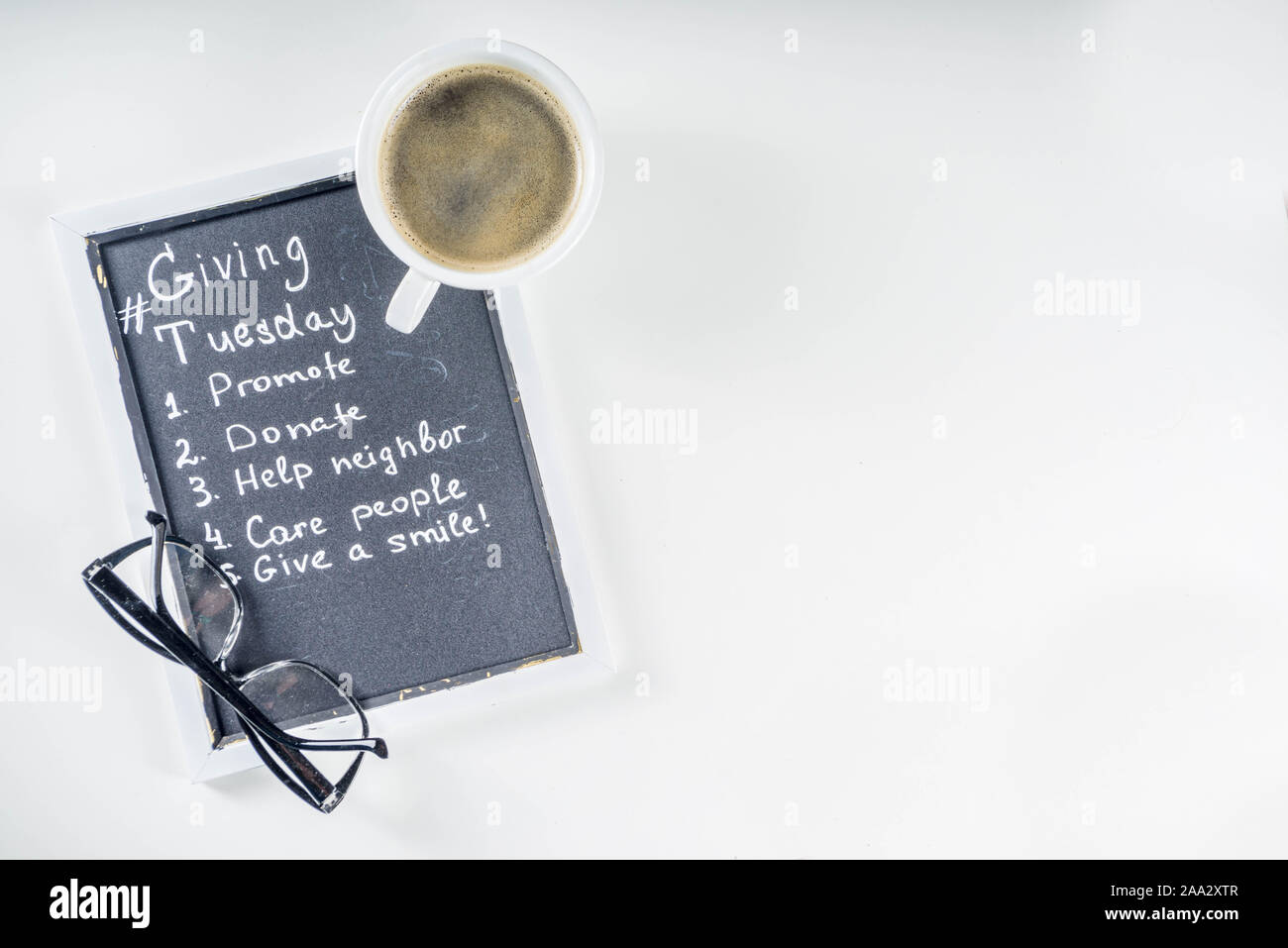 Chalk board with list of tasks, ideas, task for Giving Tuesday. Notes ...