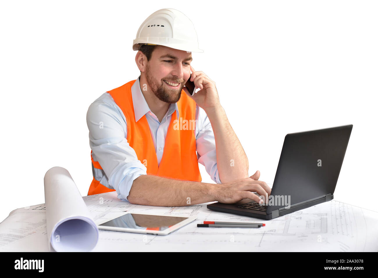 Architect / engineer at his desk planning the construction of a house ...