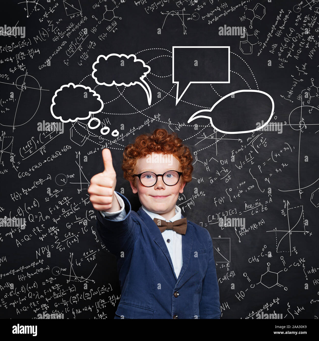 Portrait of smiling smart boy on blackboard background Stock Photo - Alamy