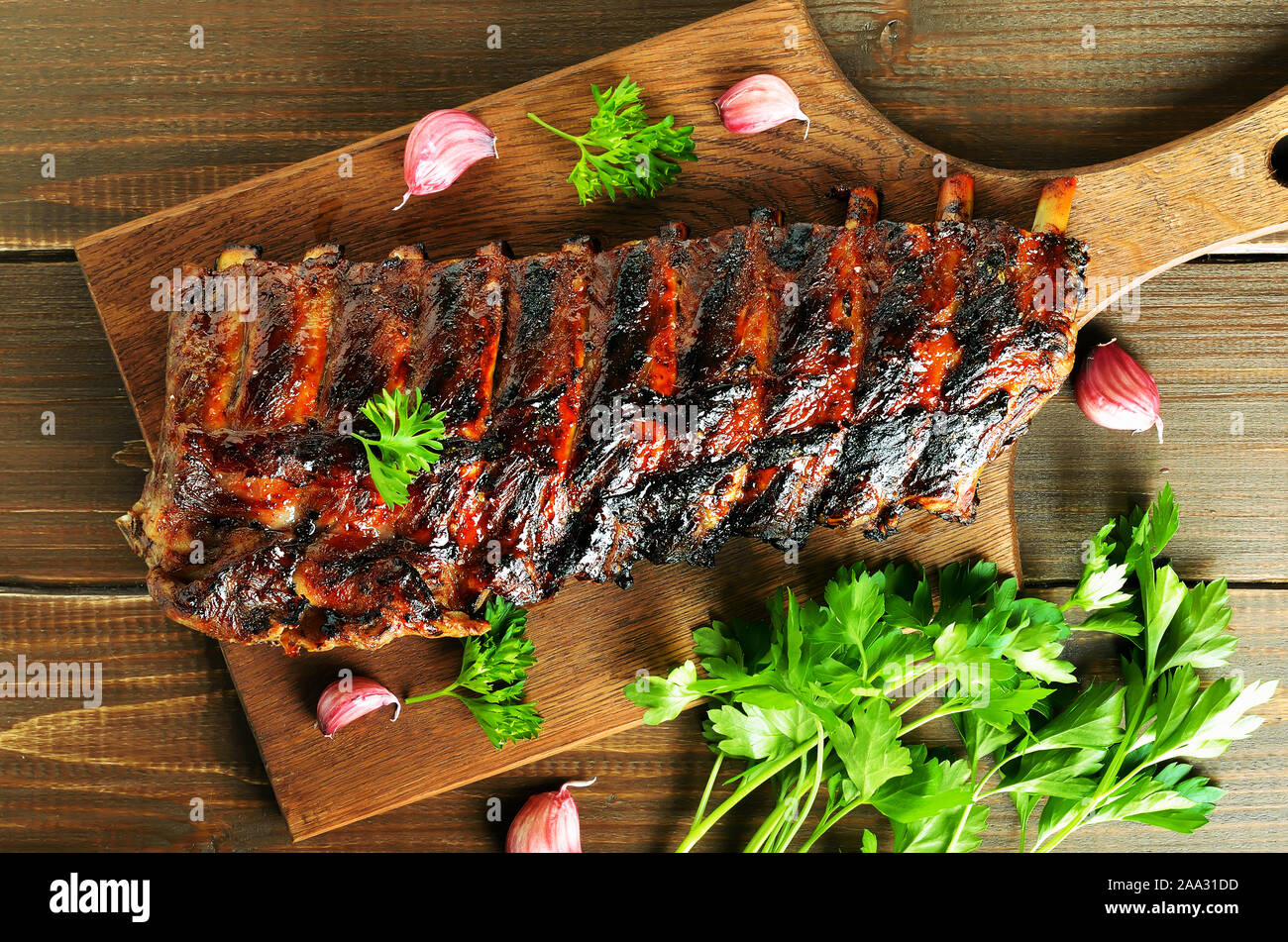 Grilled pork ribs on cutting board. Top view, flat lay. Tasty bbq meat ...