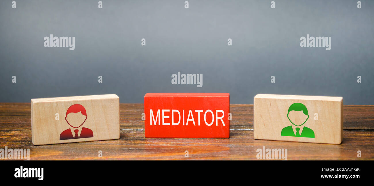 Wooden blocks with the word Mediator and two parties to the dispute ...