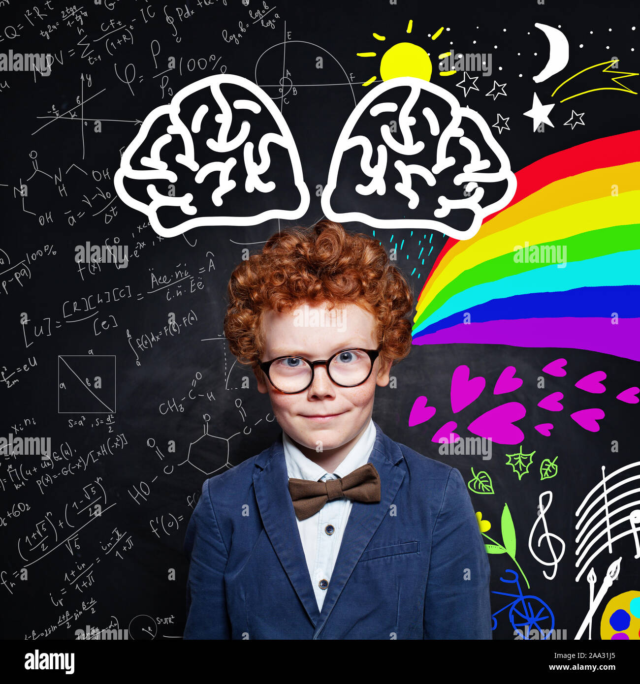 Clever little boy in glasses and student uniform on blackboard ...