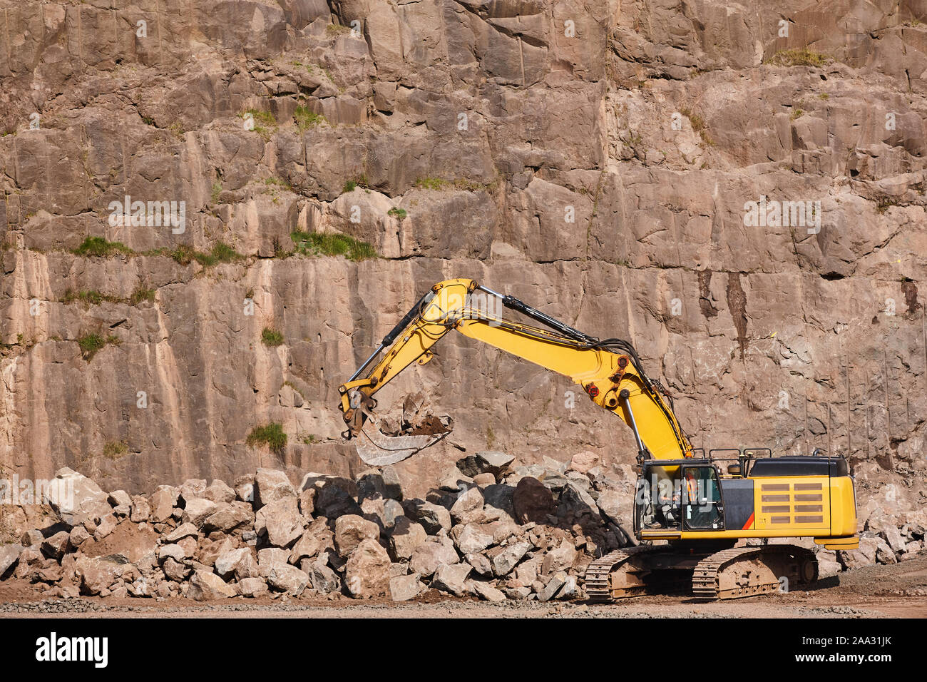 Excavator working on a stone quarry. Geological and mineral excavation ...