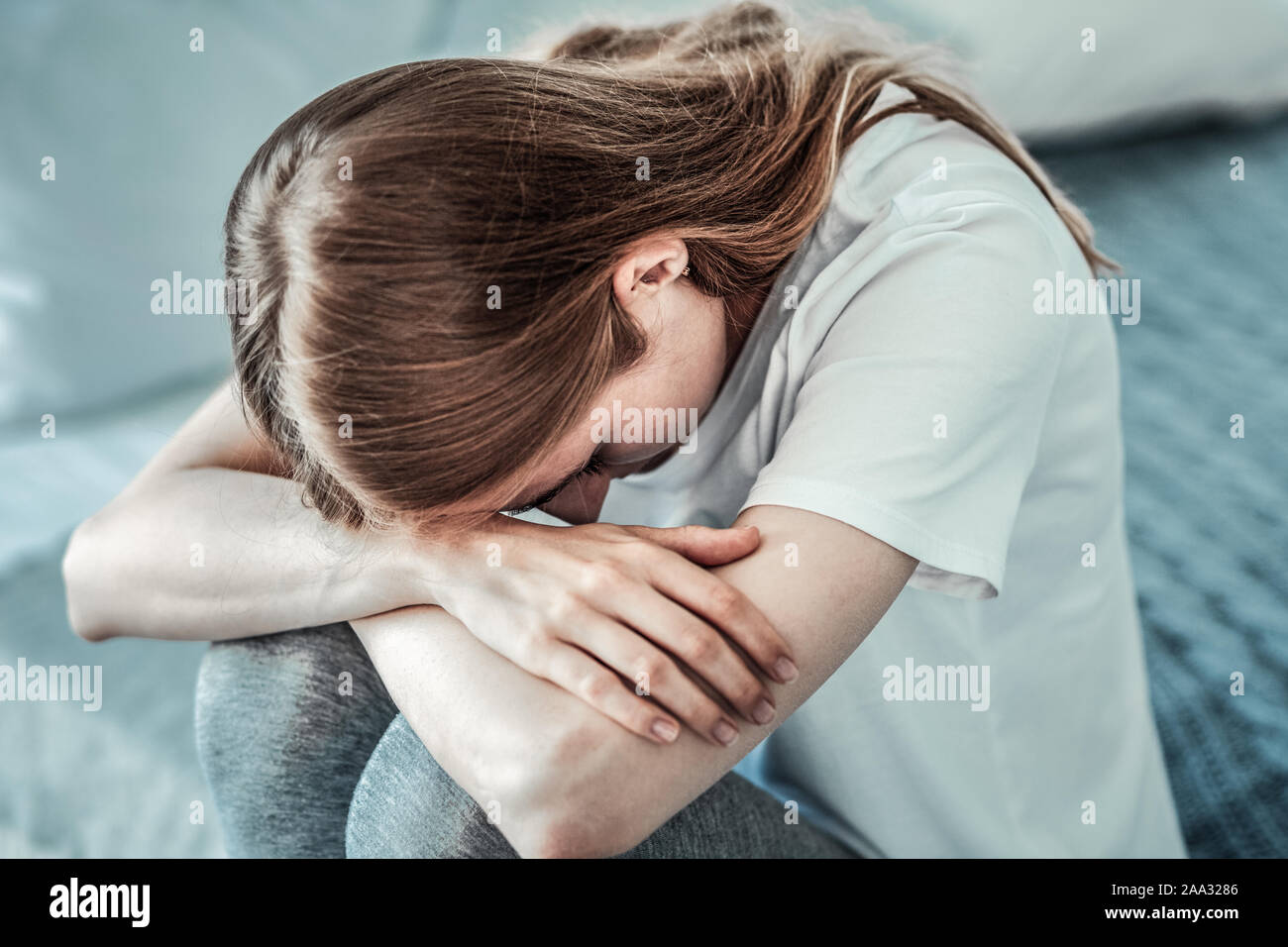 Sad depressed woman thinking about her problems Stock Photo - Alamy