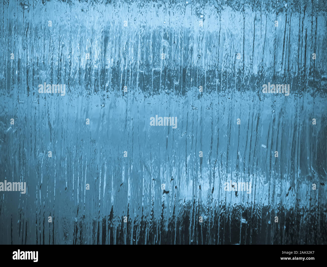Frosted glass with a cold pale blue ice feeling Stock Photo - Alamy