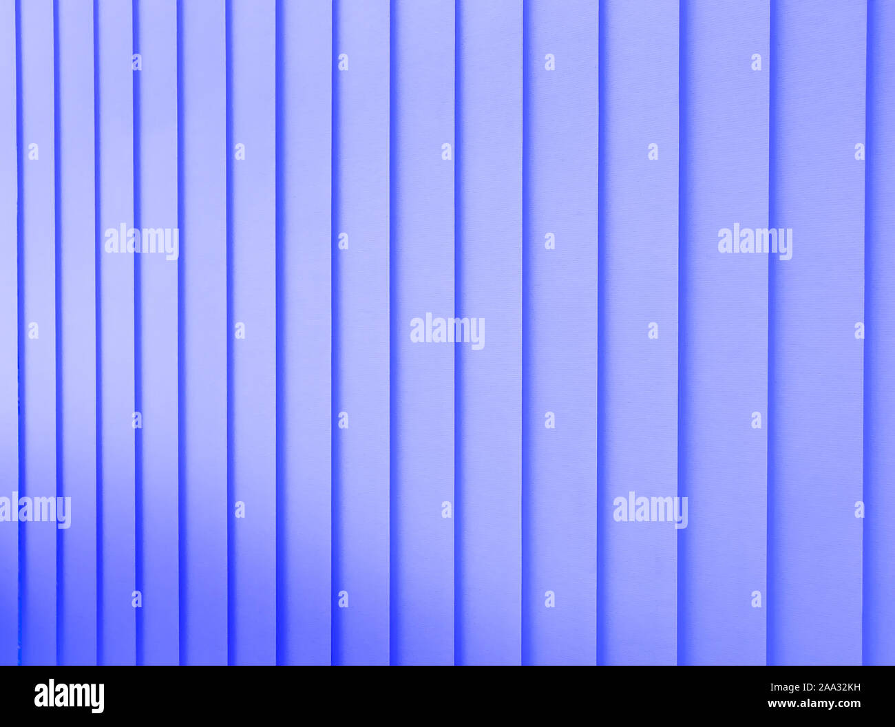 An abstract set of mauve to blue vertical lines with shading from ...