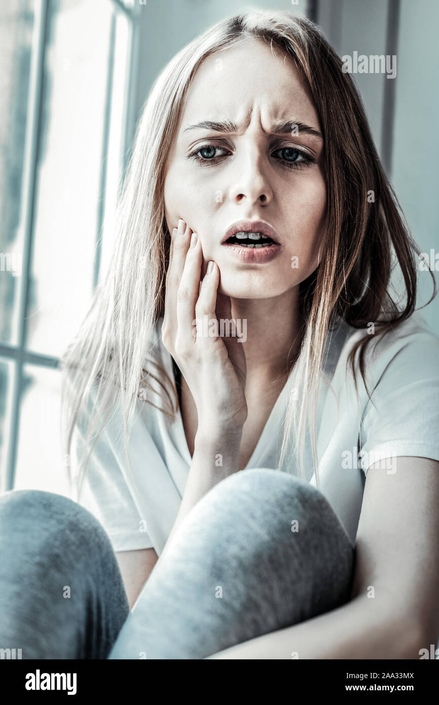 Cheerless upset woman suffering hi-res stock photography and images - Alamy