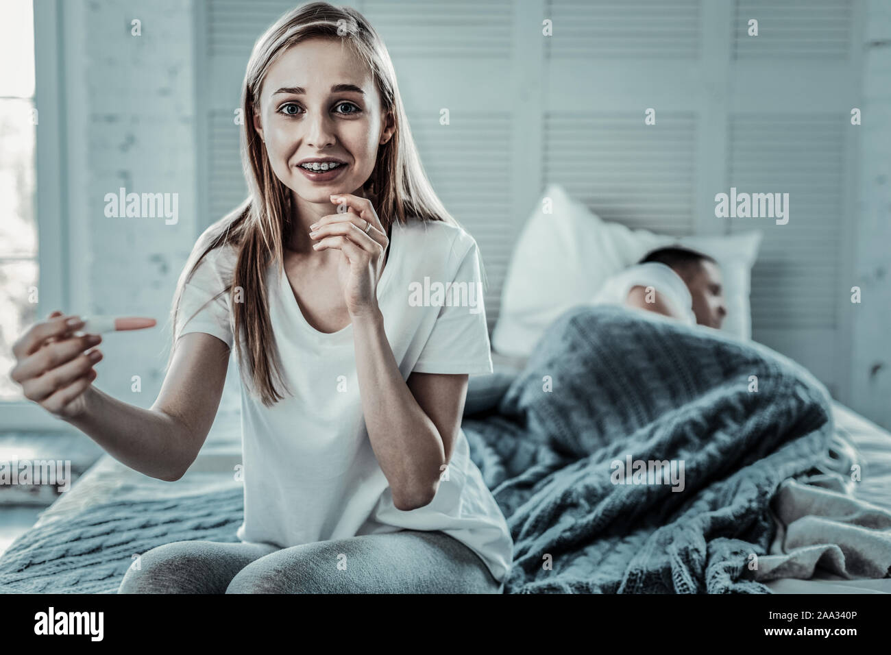 Delighted young woman finding out about her pregnancy Stock Photo - Alamy