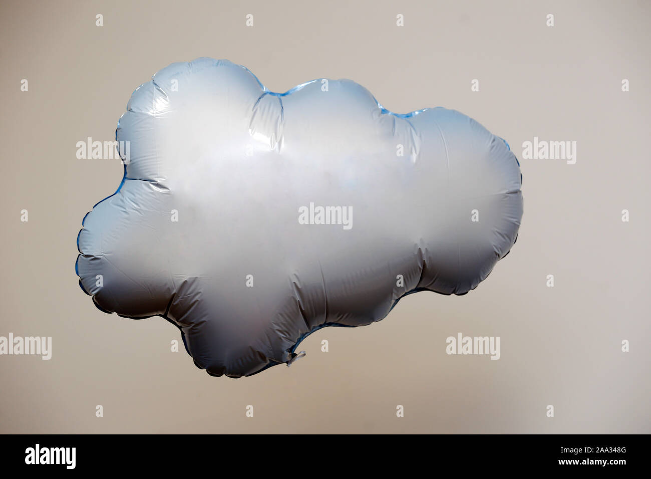 Blue cloud shaped plastic balloon Stock Photo - Alamy
