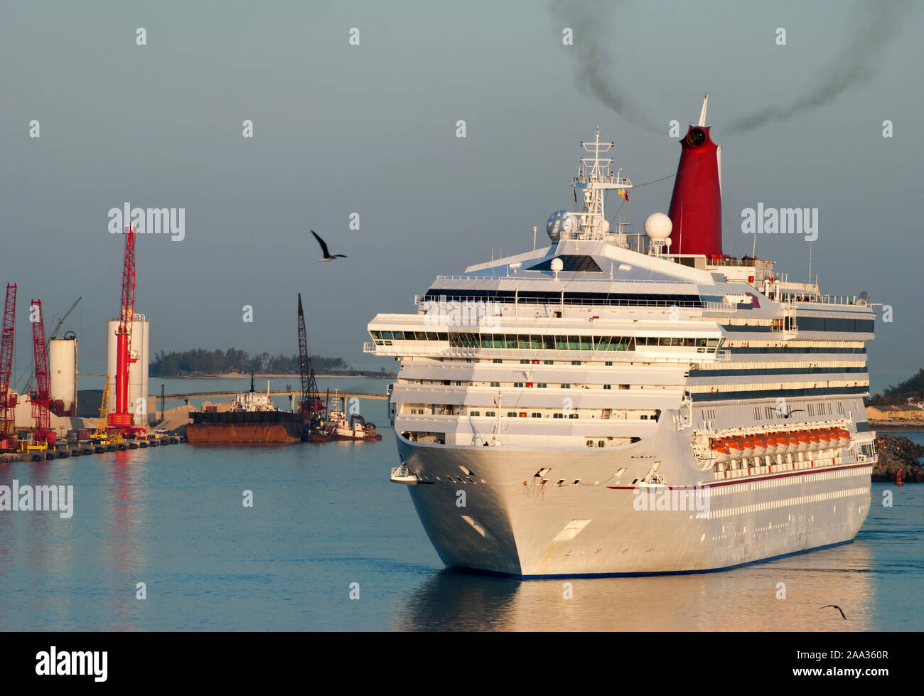 The morning view of a cruise ship maneuvering inside Nassau Harbour ...