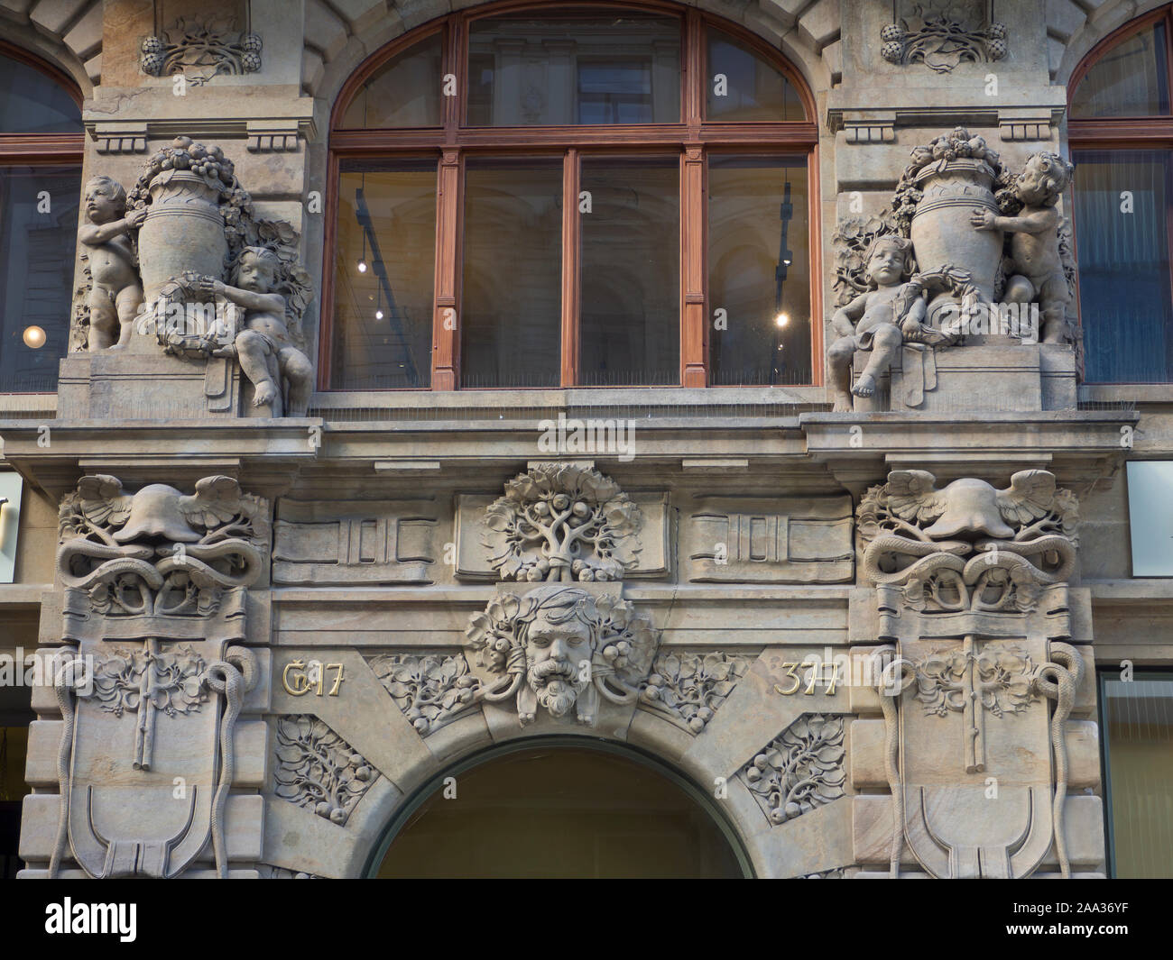 Ornately decorated building facade, over the Galerie Ocelových Figurín ...
