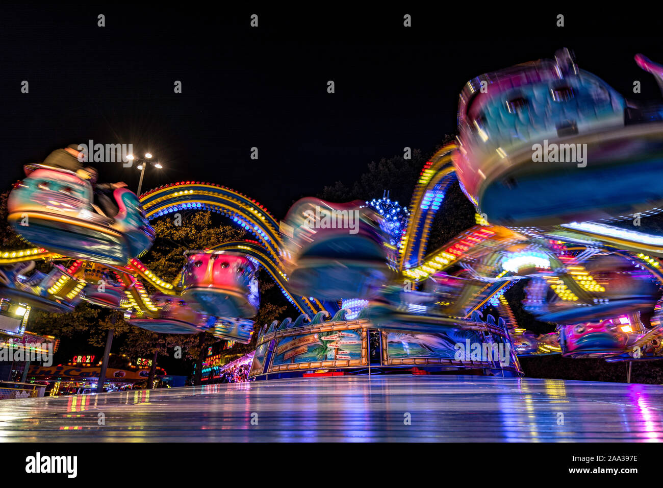 Kermis Amsterdam north. bumper cars, fun fair, Carousel, Evening shot ...