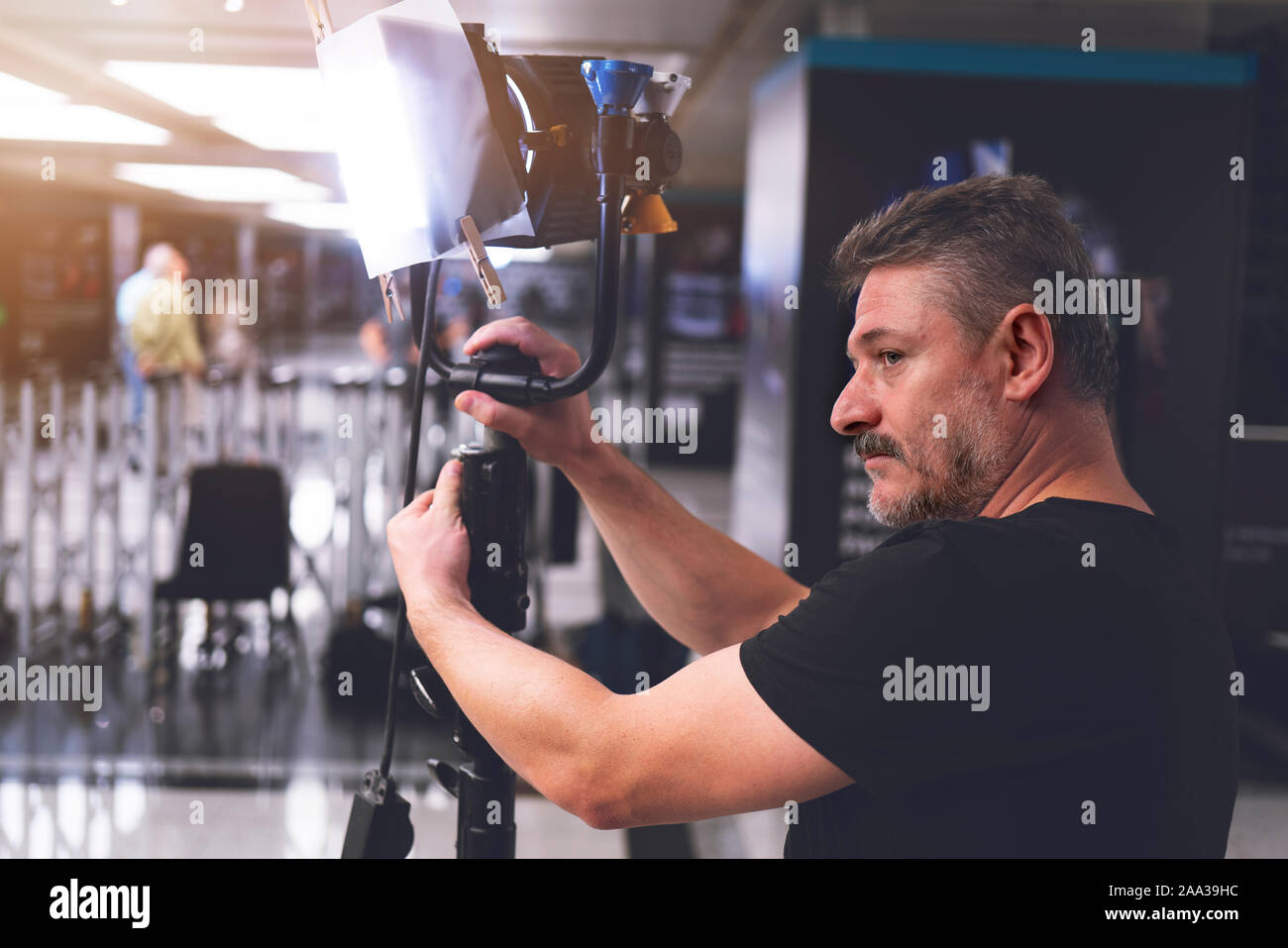 lighting man service control follow light in production house Stock ...