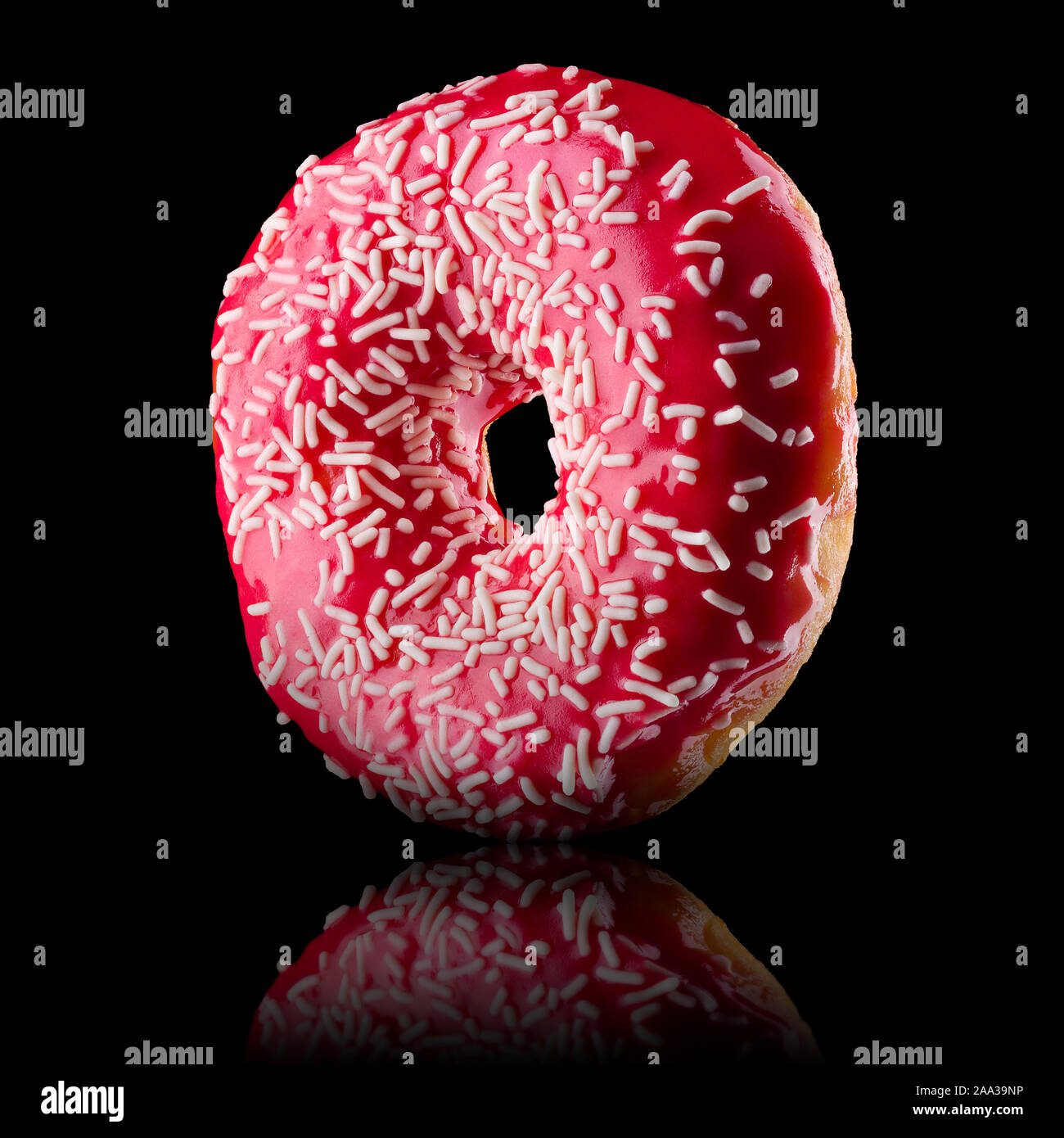 Glazed donut with reflection on a black background rotated in three ...