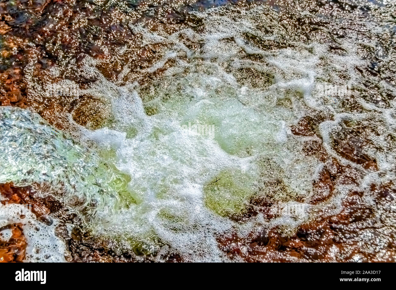 Water flowing out of a metal storm/drainage pipe creating thousands of ...