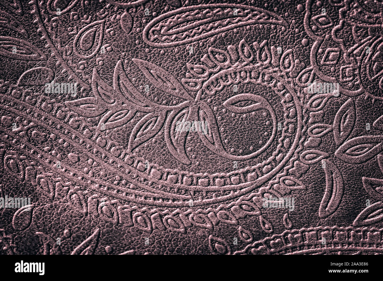Texture of genuine leather close-up, dark violet color with embossed ...