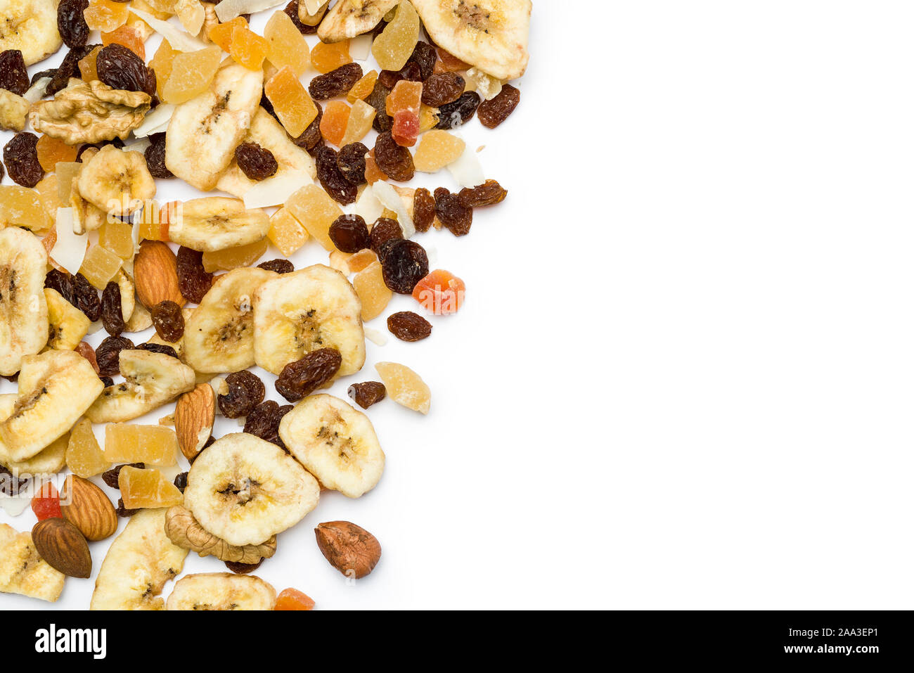 top view of dried fruits scattered on white background with copy space ...