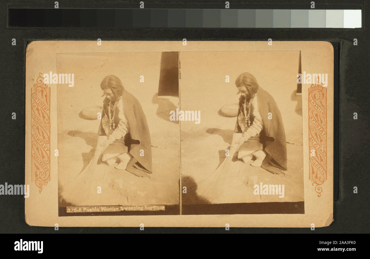 A Pueblo woman sweeping her floor.; A Pueblo woman sweeping her floor ...