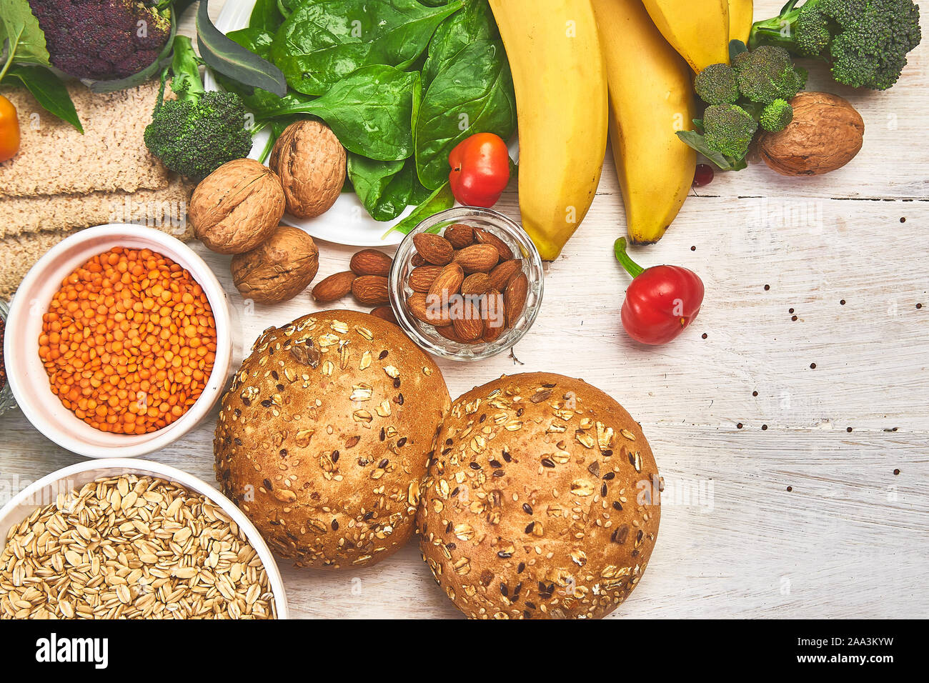 Selection food rich in fiber on white wooden background Stock Photo - Alamy