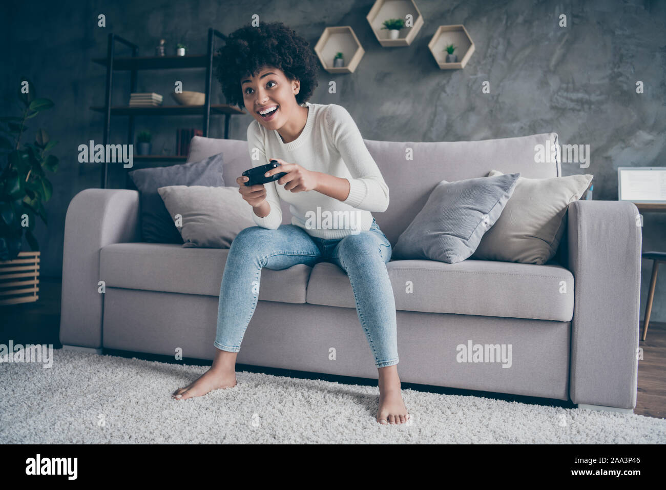 Photo of funny dark skin curly lady playing video games addicted want ...