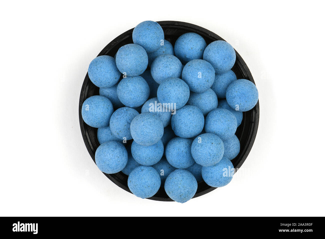 Bowl full of boilies, fishing baits for carp, isolated on white ...