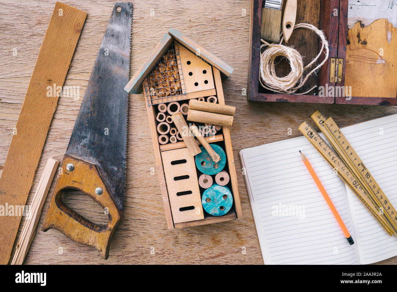 Making wooden insect house decorative bug hotel Stock Photo - Alamy