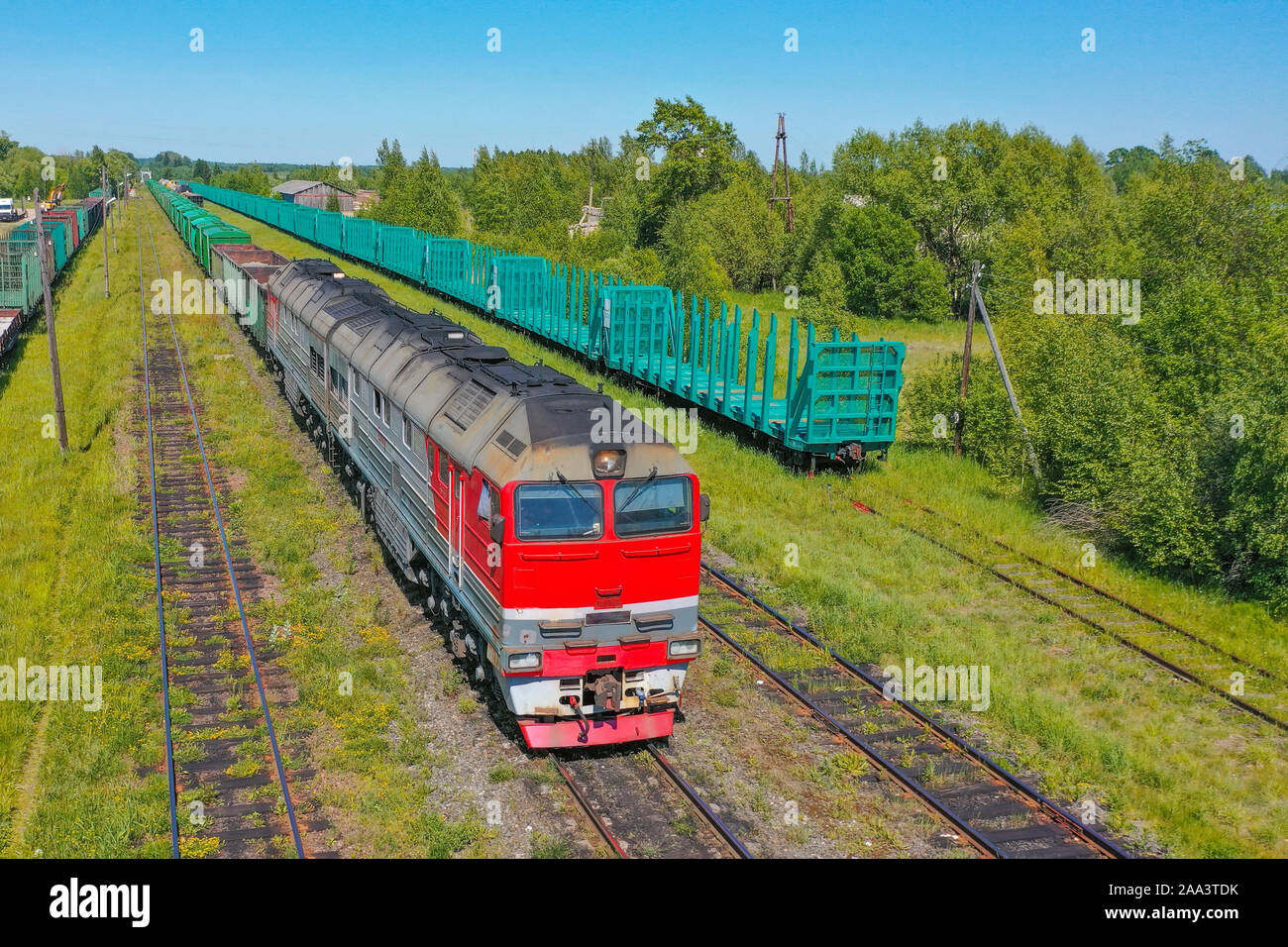 Diesel locomotive train and carriage hopper at a reloading freight ...