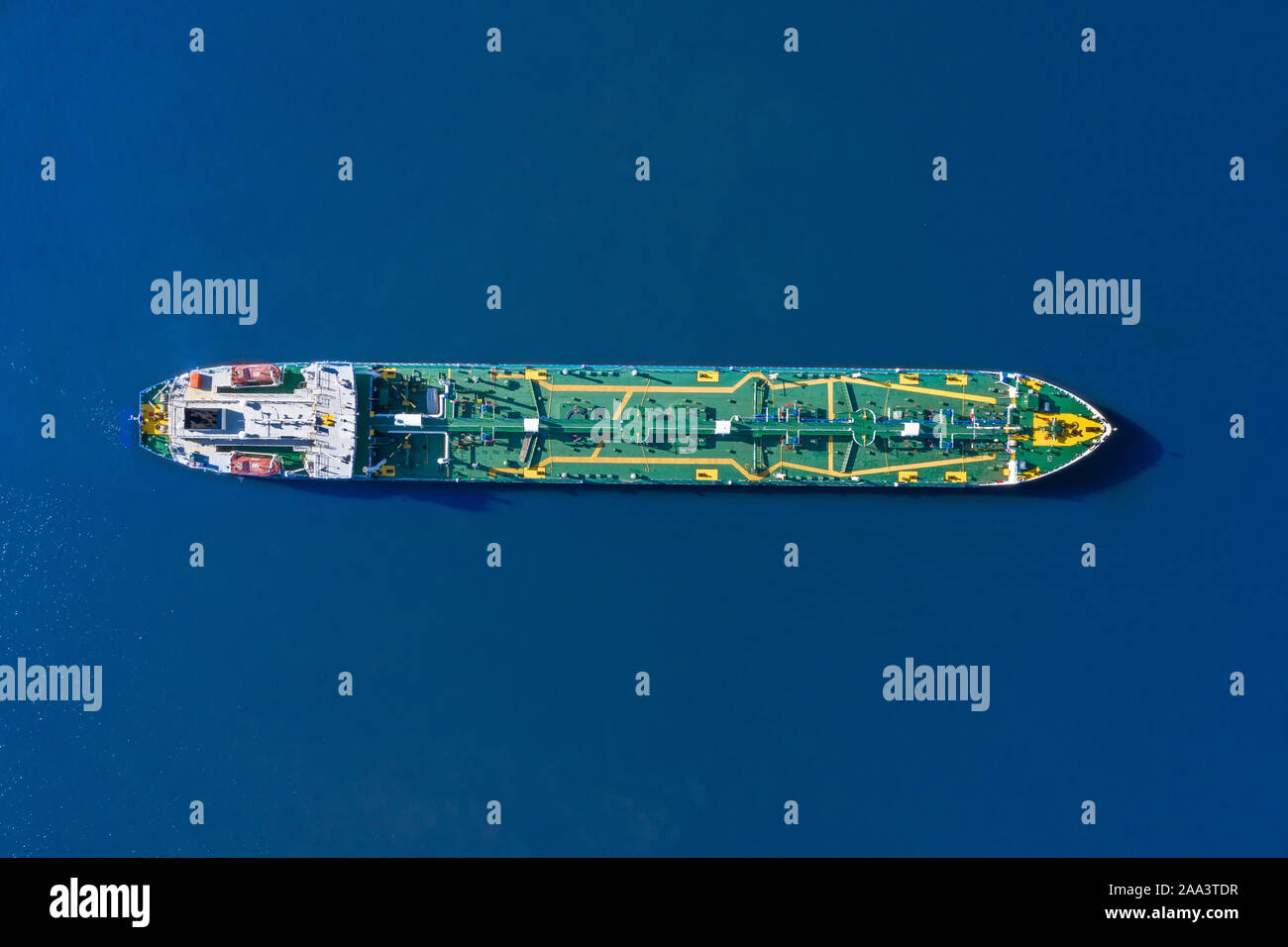 Aerial view tanker ship with liquid bulk cargo is sailing in blue water ...