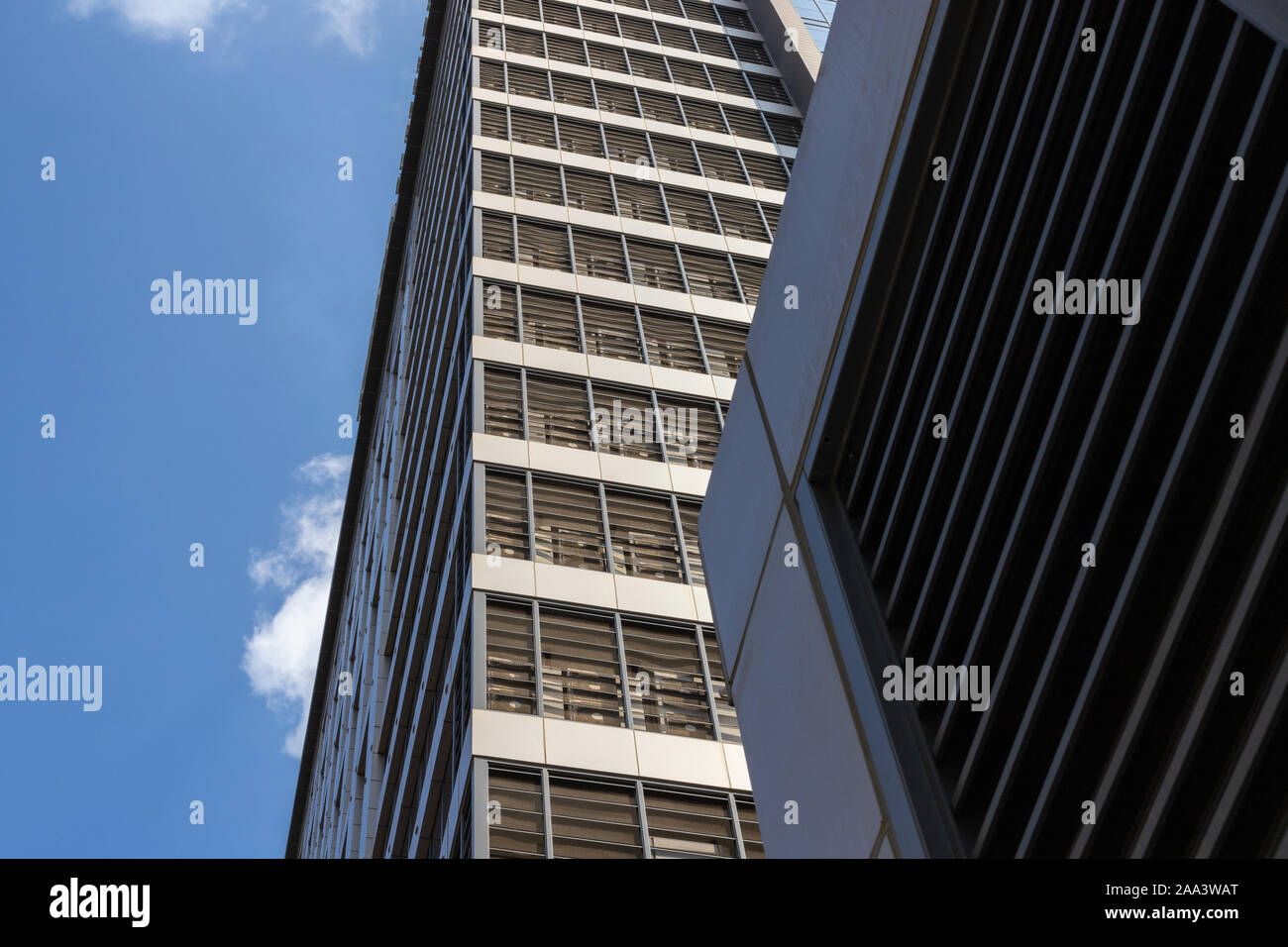 Tall building is shot from below. Blue sky and skyscraper and copy ...