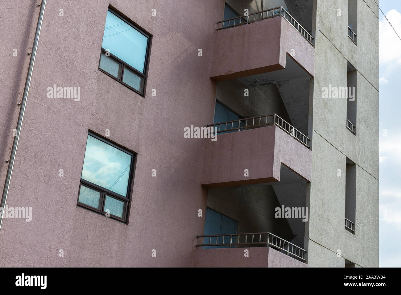 Facade of multi-story building. Fire escape staircase. Urban elements ...