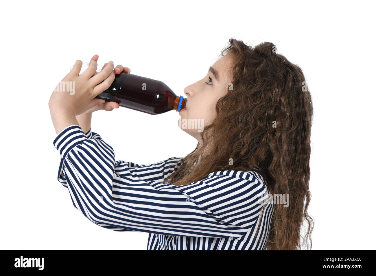 Child drinking Cola from bottle. On white background. High resolution ...