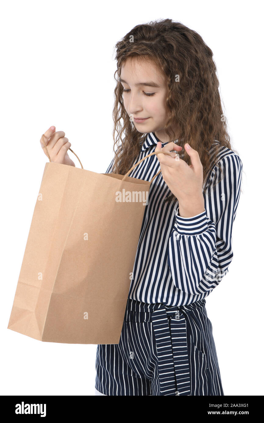 Child with a packet isolated on white background. Kid happy shopping in ...