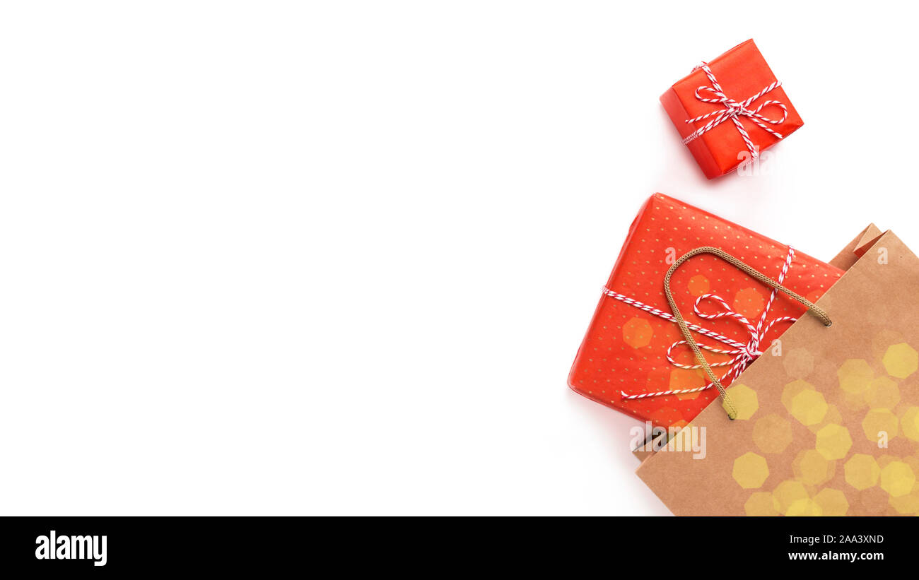 Paper bag with different size Christmas gifts on white Stock Photo - Alamy