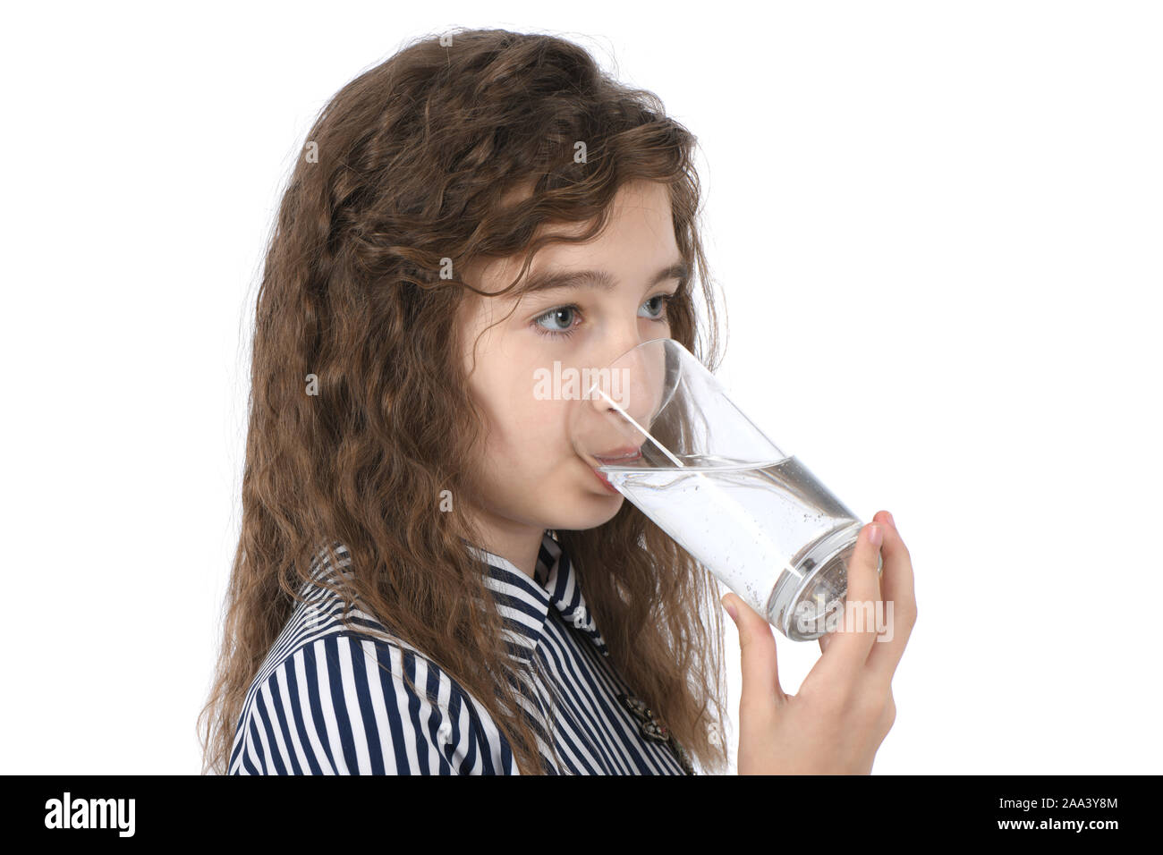 Portrait of a girl drinking mineral water isolated on white. High resolution photo Stock Photo ...